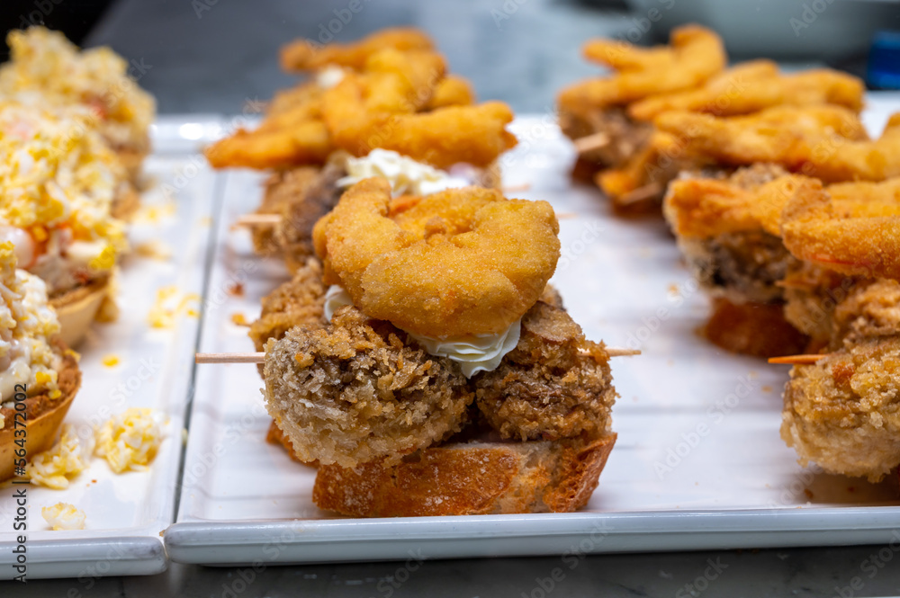 Typical snack of Basque Country, pinchos or pinxtos, small piece of ...