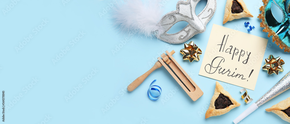 Greeting card and symbols of Purim on light blue background with space ...