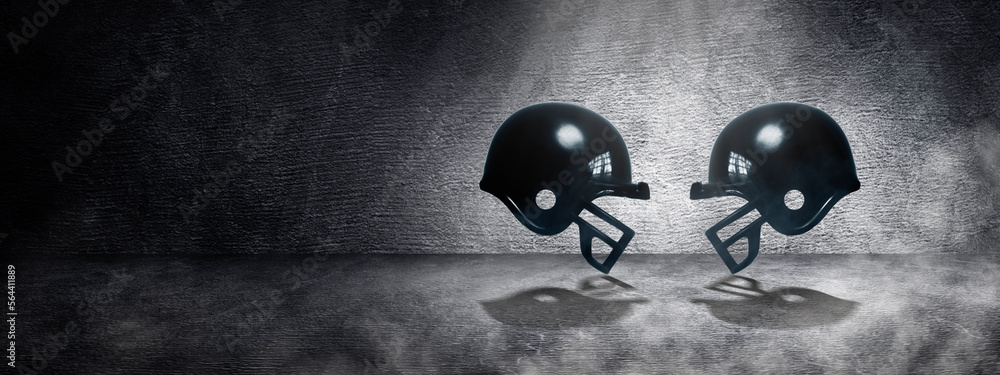 2 football helmets facing each other - concept of rivalry between teams ...
