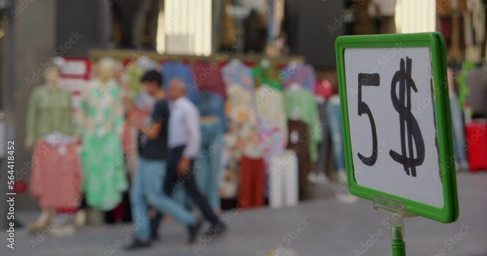 Video „Five dollar price tag in foreground for discounted clothing sold ...