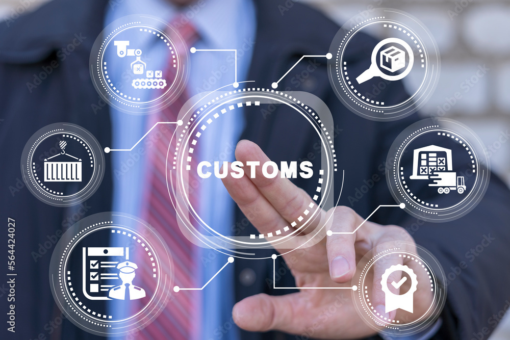 Businessman using virtual touchscreen presses the abbreviation: CUSTOMS ...
