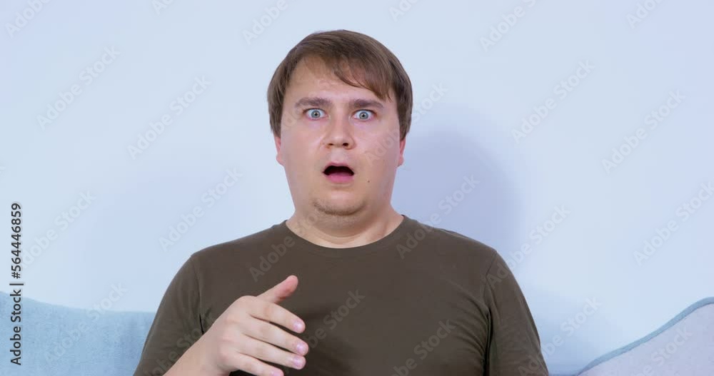 Man Holds Broken Joystick Hands Looks Screen Shocked Rage Turns Head Addicted Gamer Sits Couch