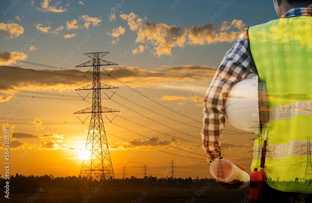 Foto de Electrical engineer is laying a power transmission system with ...