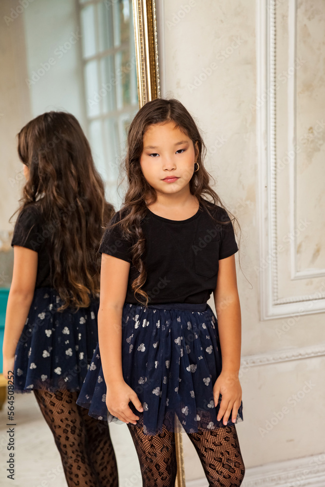 Portrait asian little girl kid fashion model in stylish black clothes ...