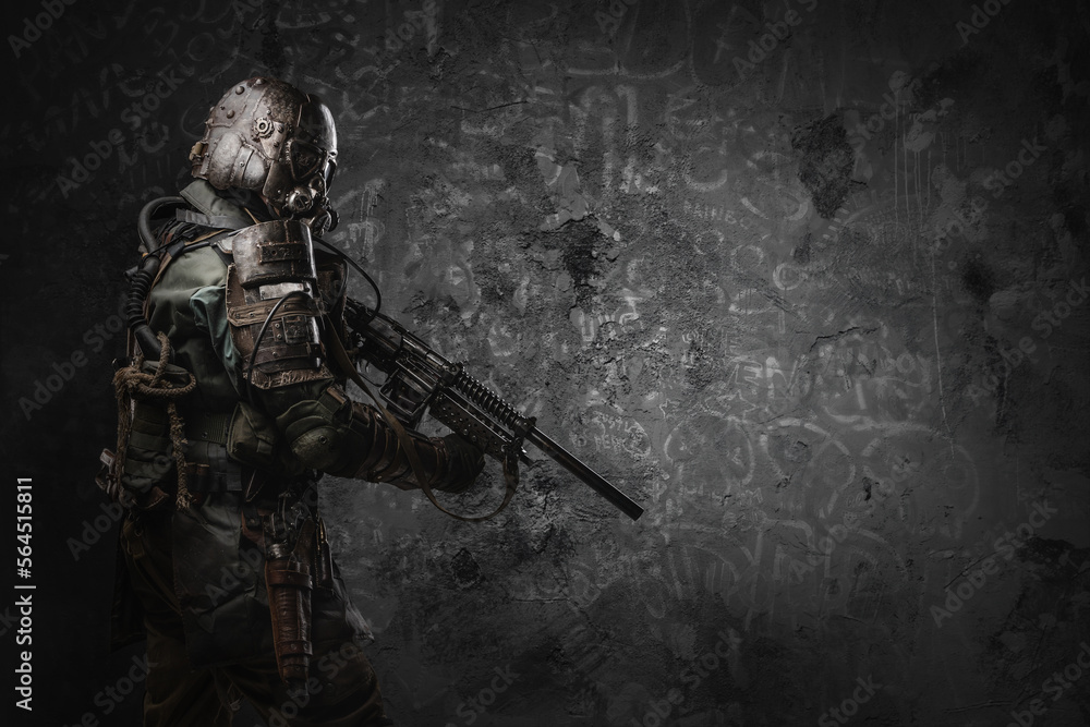 Shot of post apocalyptic soldier with uniform and shotgun dressed in ...