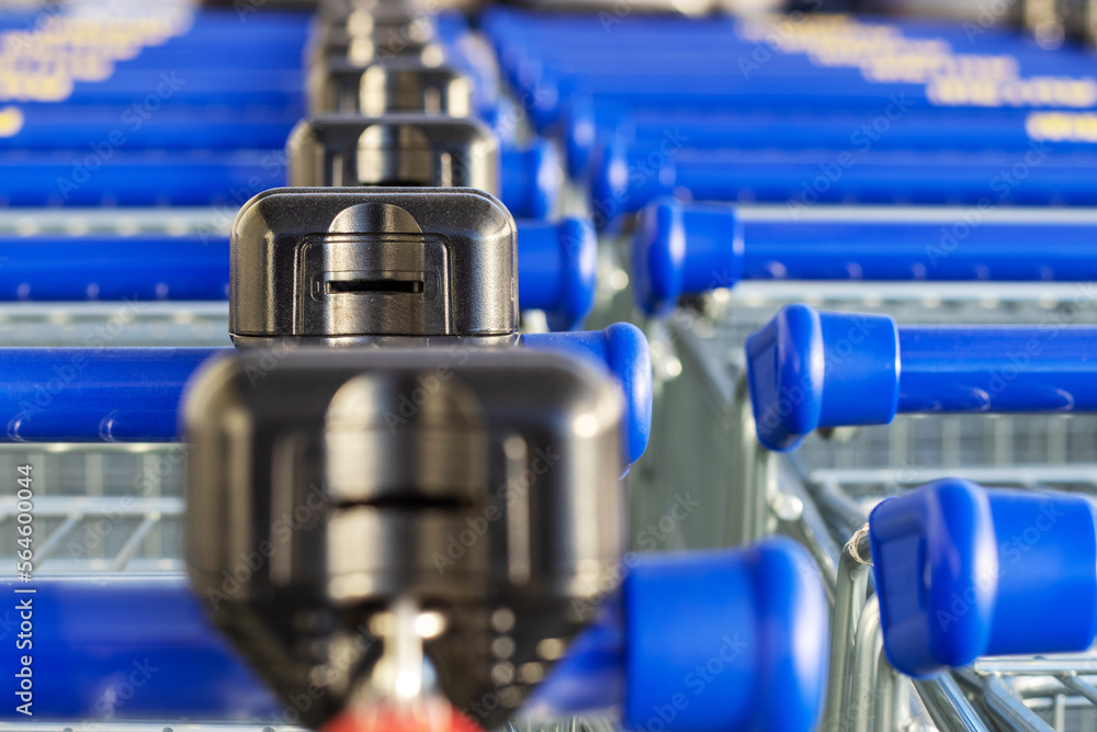 many trolley shopping cart with coin lock anti theft system outside in ...