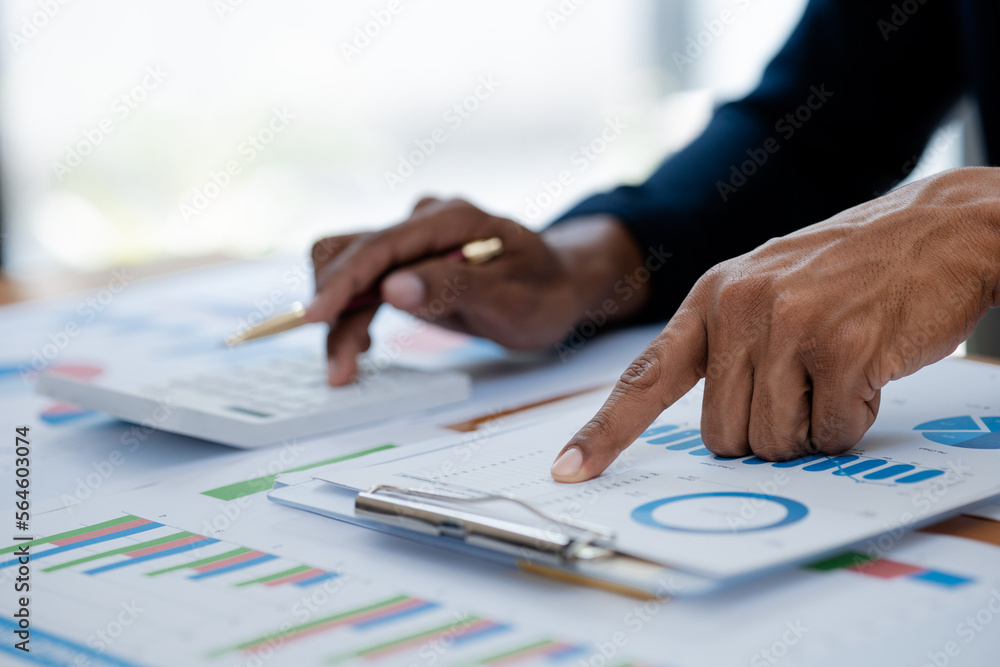 Business man pointing to a pie chart document showing company financial ...
