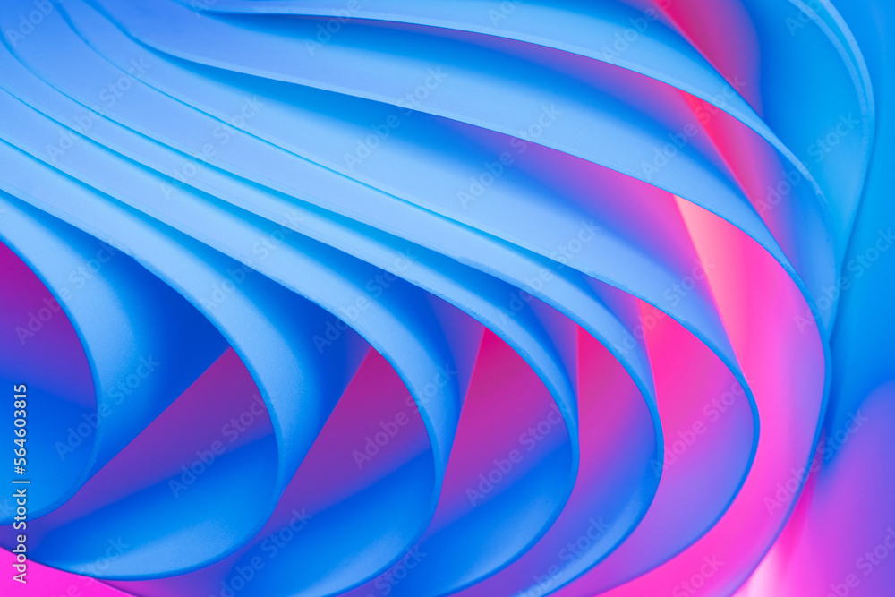 Magenta and blue abstract curvy shape against the colorful pink ...