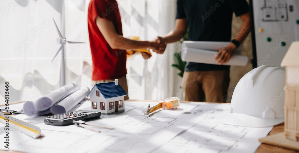 Engineer and contractor join hands after signing contract,They are ...