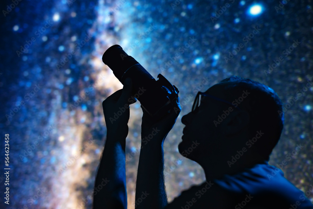 Astronomer photographing Milky Way night sky with a camera. Stock Photo ...