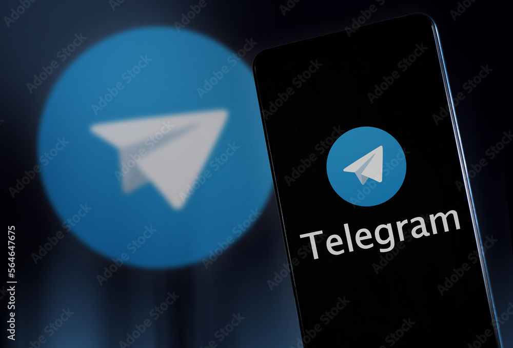 Telegram logo on smartphone display and background. Communication ...