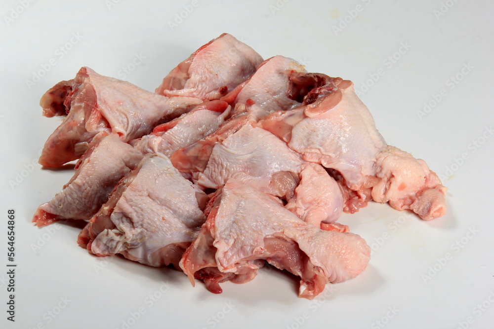Fresh chicken skeletons on a white background. Raw chicken backs skin ...