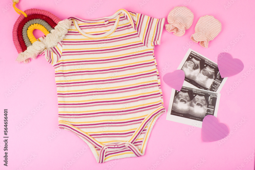 ultrasound (USG) results in sheets and baby clothes with boho rainbow ...