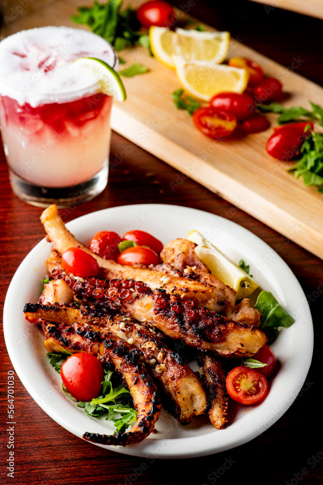 Grilled octopus. Prepared in traditional Italian style: fried in olive ...