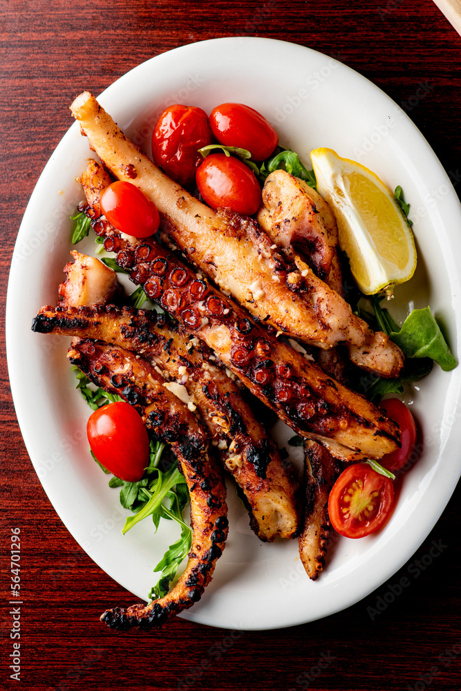 Grilled octopus. Prepared in traditional Italian style: fried in olive ...