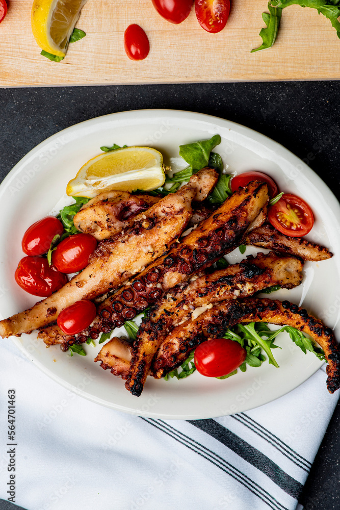 Grilled octopus. Prepared in traditional Italian style: fried in olive ...