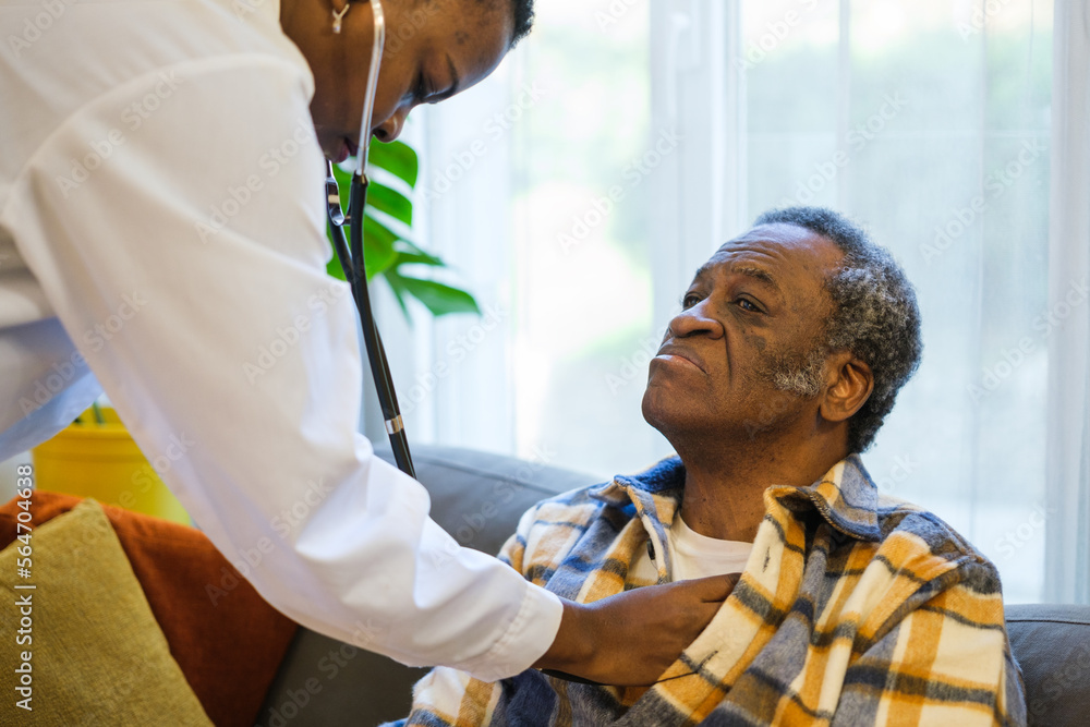 Senior man receiving the doctor at home to find out his state of health ...