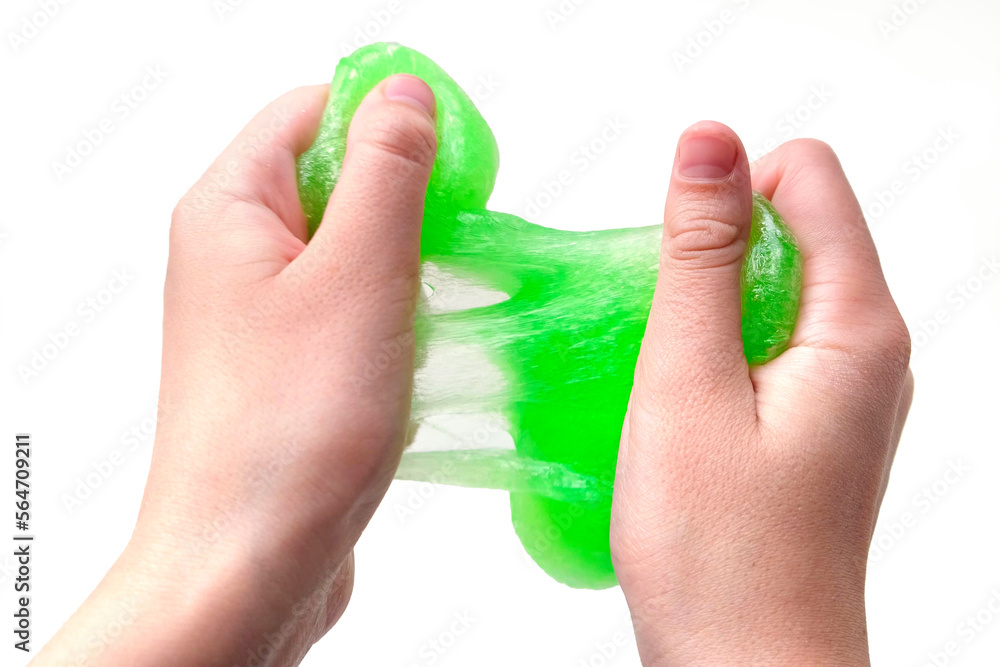 Hand Playing with textured slime on white background. Teen hand holding ...