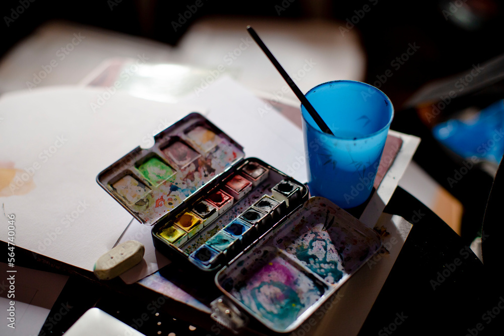 Art workshop, color palette of watercolors and other items in an art ...