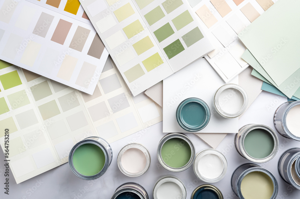 Tiny sample paint cans during house renovation, process of choosing ...