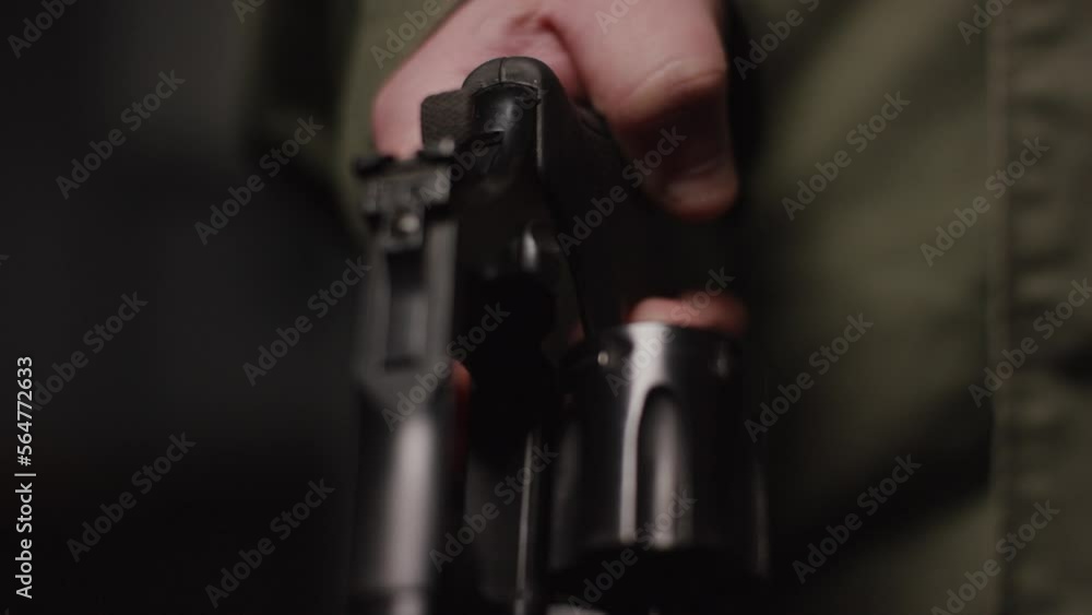 Hunter holding and loading Revolver before shooting it at an shooting ...