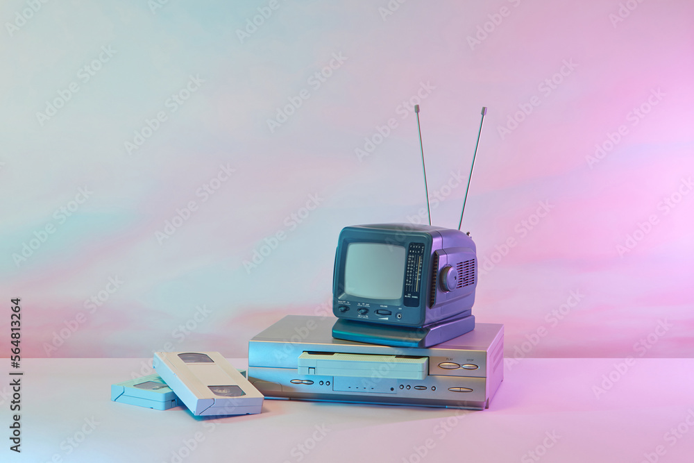 Foto de Vintage TV with VCR player and VHS cassettes. do Stock | Adobe ...