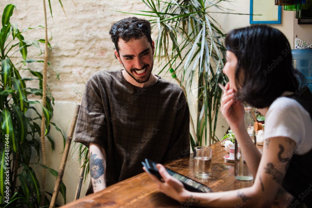 Co-workers talking at studio Stock Photo | Adobe Stock