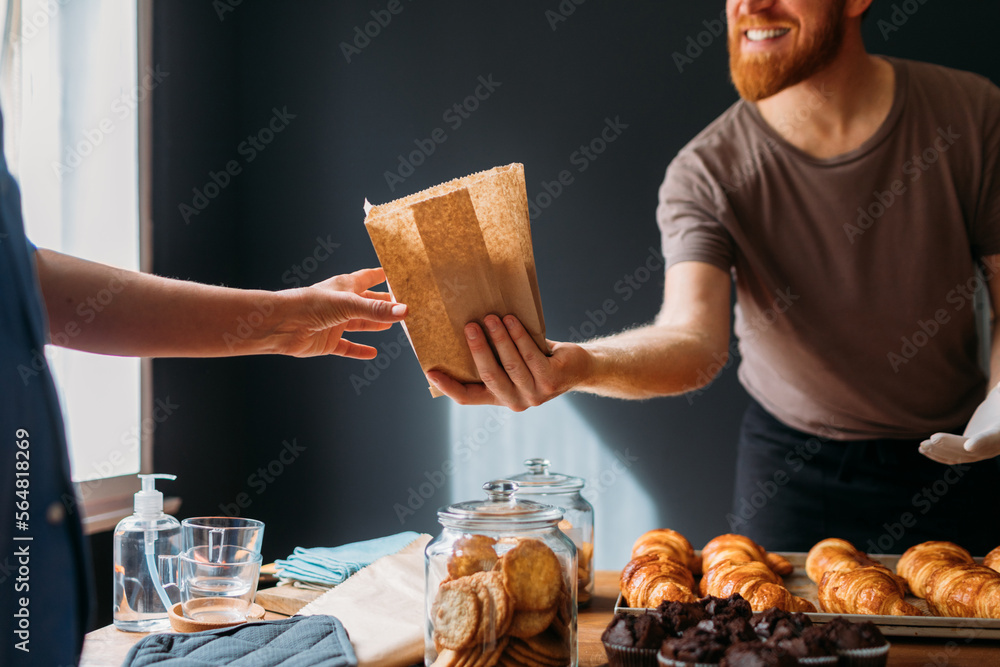 Baker Serving Customer Stock Photo | Adobe Stock