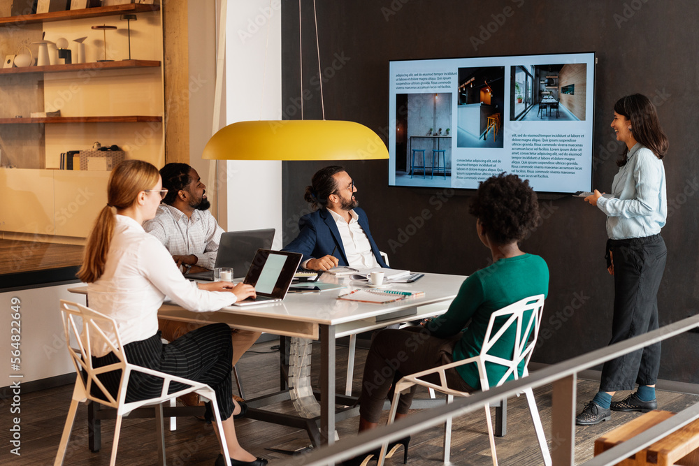 Smiling Group Of Business People Watching Presentation Stock Photo ...