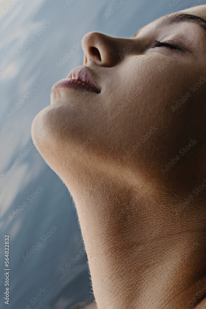Half face profile portrait of a woman with closed eyes in water Stock ...
