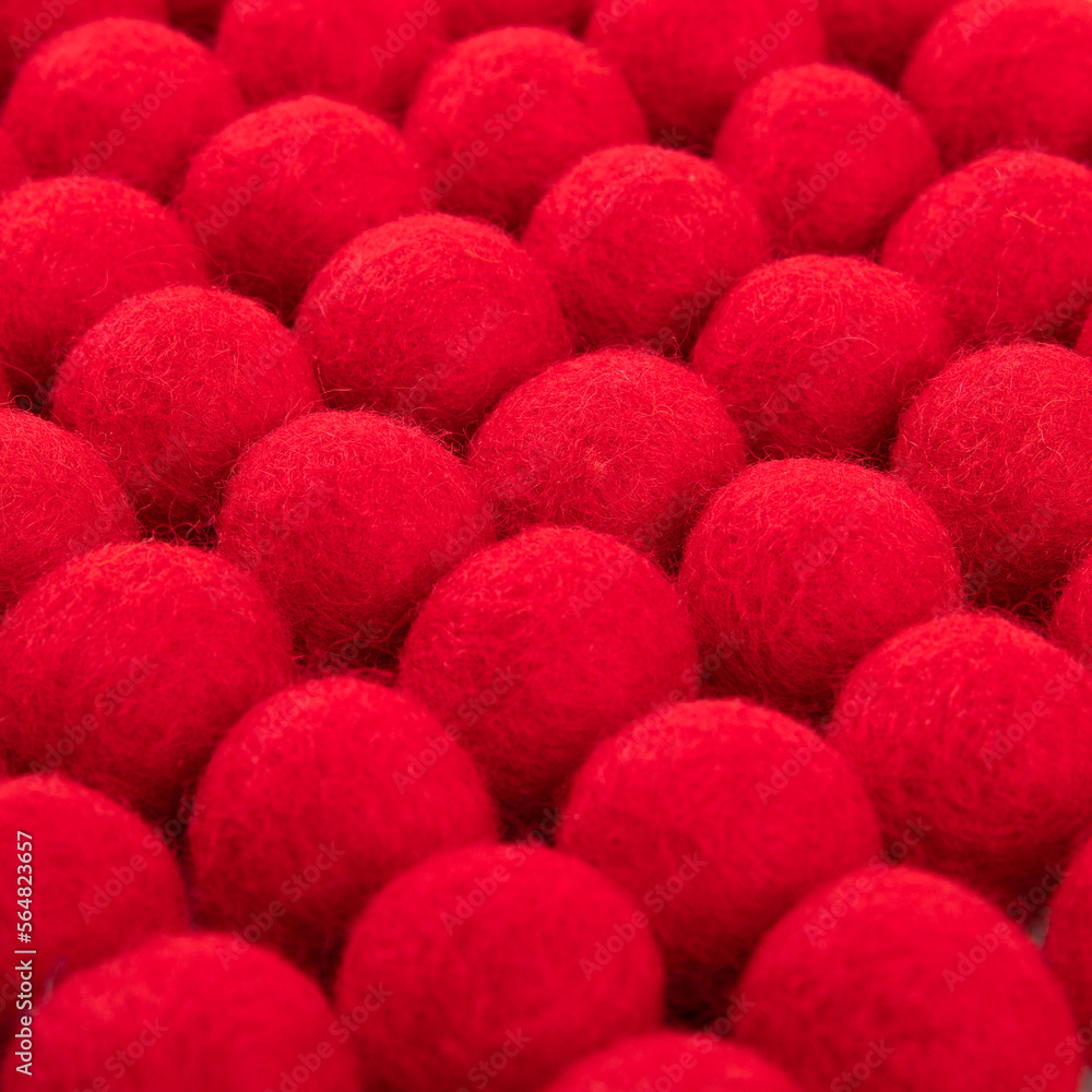 Red felt ball pattern Stock Photo | Adobe Stock