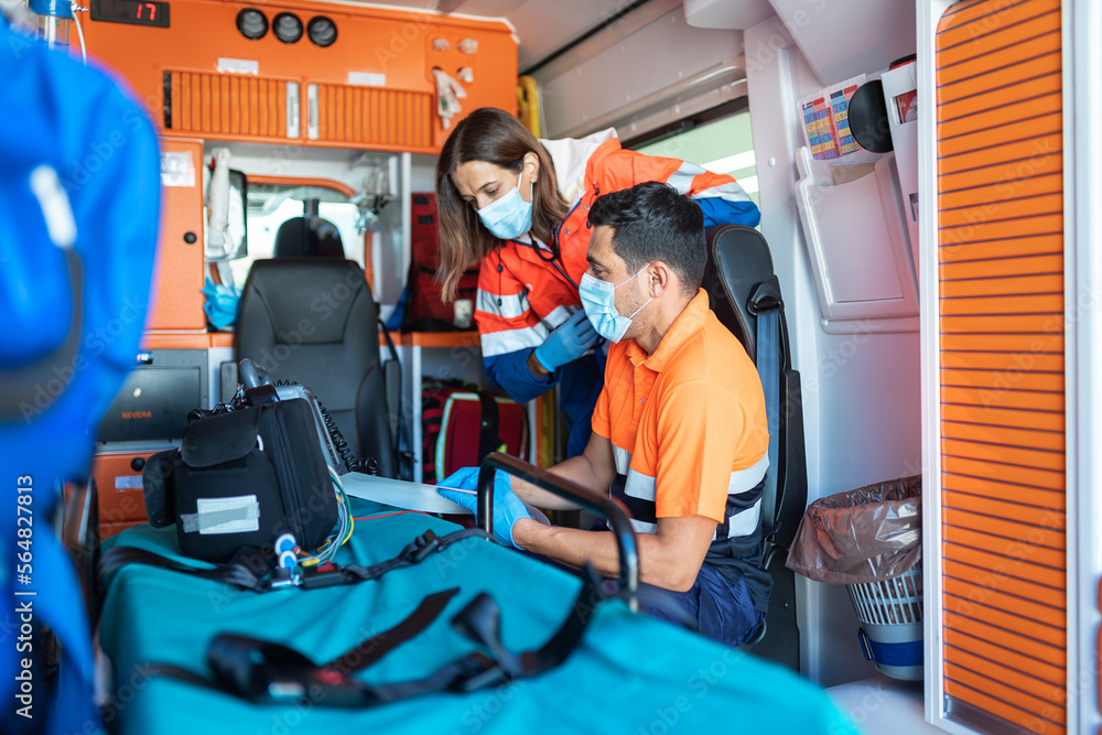 Paramedic Workers Inside an Ambulance Stock Photo | Adobe Stock