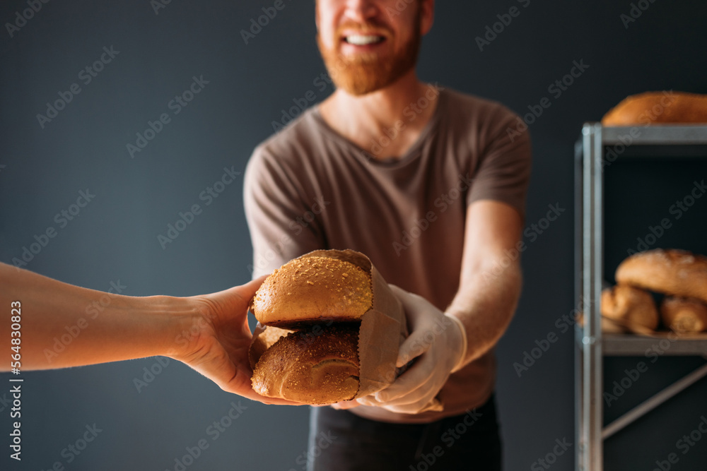 Baker serving Customer Stock Photo | Adobe Stock