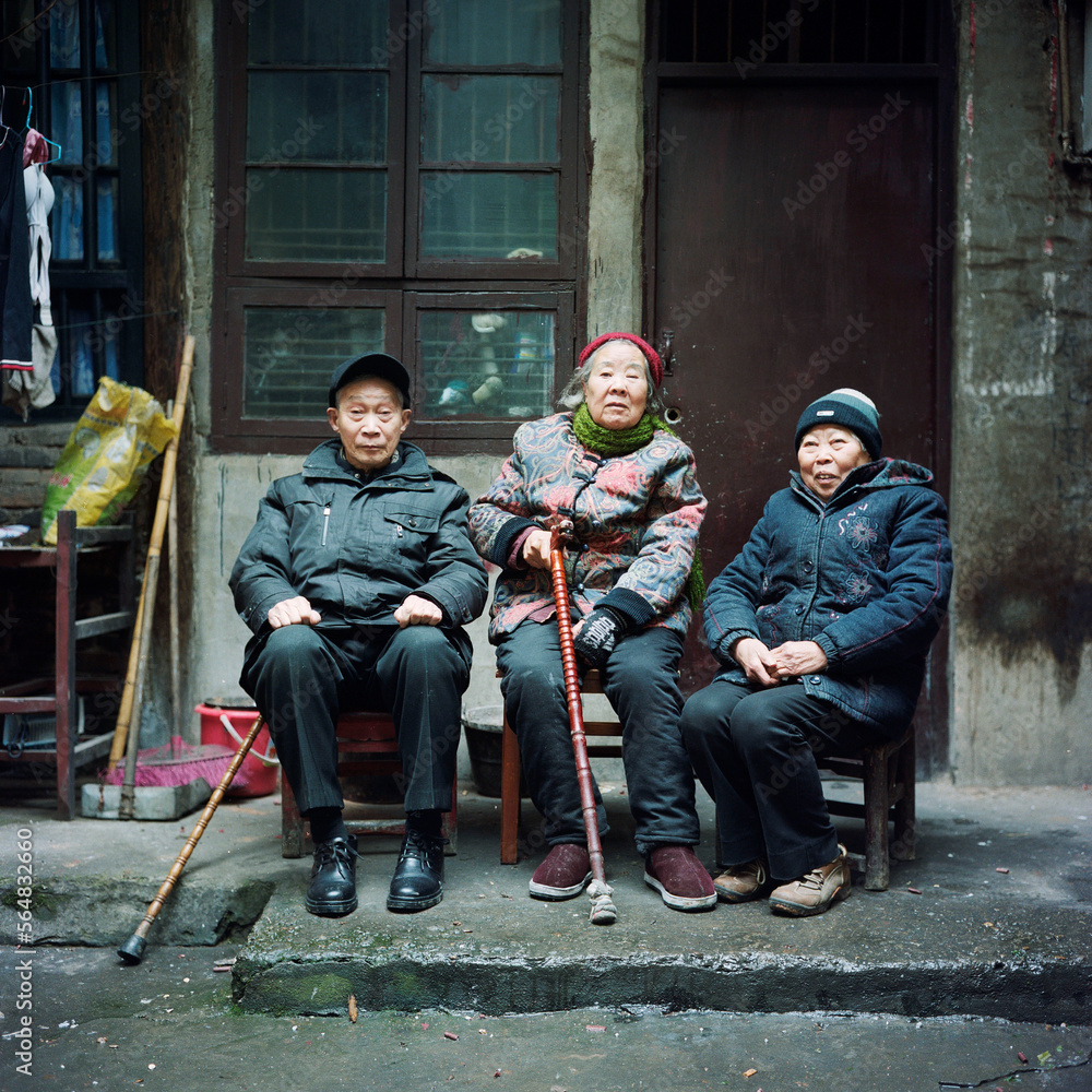 Three old people sitting together Stock Photo | Adobe Stock