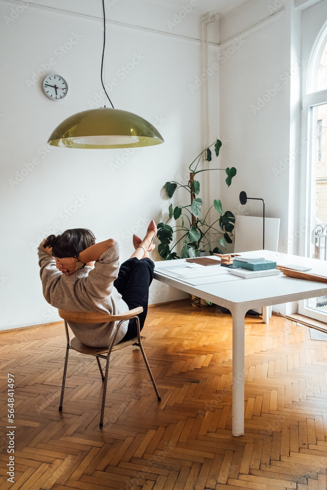 Woman Relaxing in Office With Her Feet Up on Her Desk Stock Photo ...