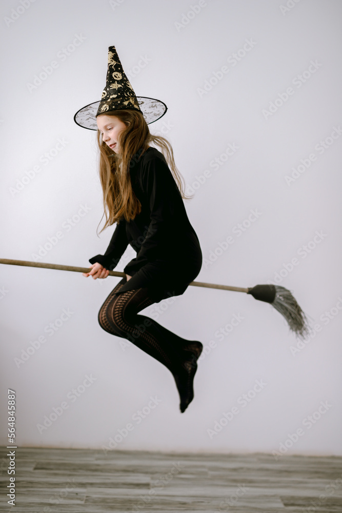 witch on a broomstick Stock Photo | Adobe Stock
