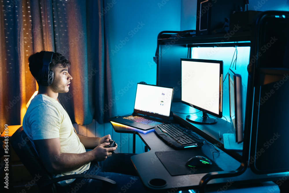 Gamer playing video games on pc Stock Photo | Adobe Stock