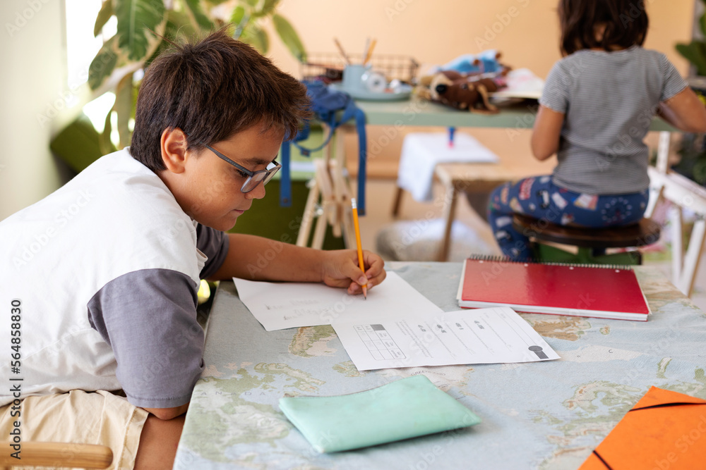 kid doing homework Stock Photo | Adobe Stock