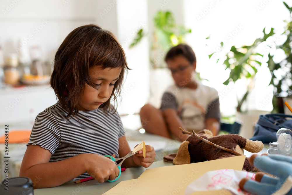 little girl using scissor Stock Photo | Adobe Stock