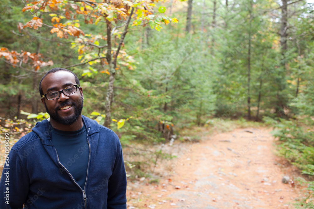 Caribbean man smiling on trail at Bradbury Mountain State Park Stock ...