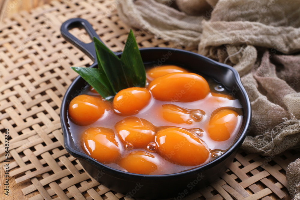 Kolak (or kolek) is a typical Indonesian dessert made from palm sugar ...