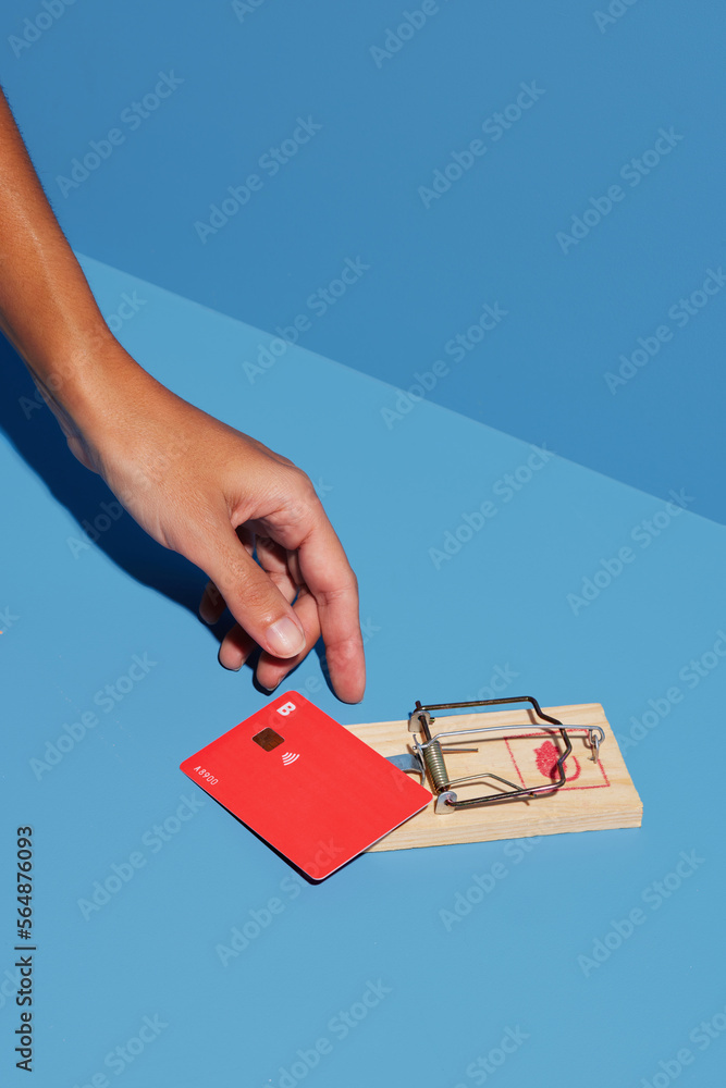 Credit card stuck in mousetrap Stock Photo | Adobe Stock