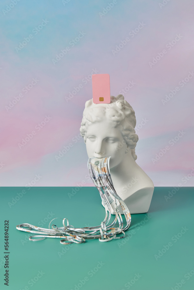 Shredded banknote sticking out from antique bust. Stock Photo | Adobe Stock