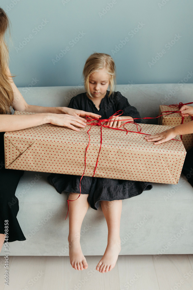 Opening Christmas gift box. Stock Photo | Adobe Stock