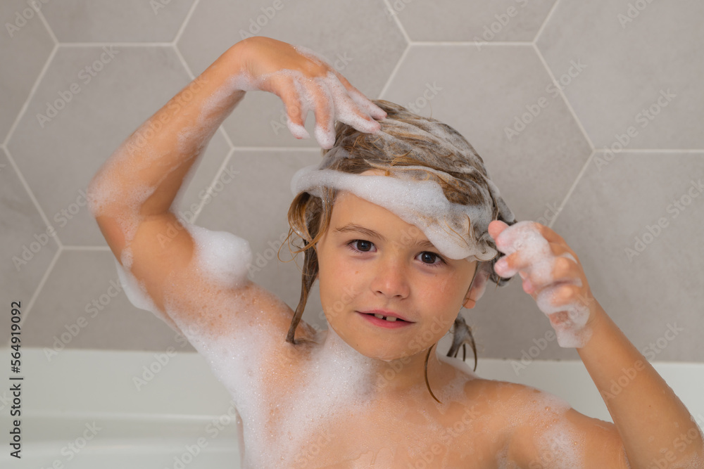 Kid washing hair. Kids shampoo. Cute child washing and bathing in a ...