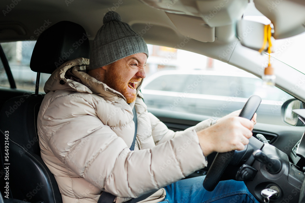 Angry driver in a traffic jam. He screams and gesticulates, Stock Photo ...