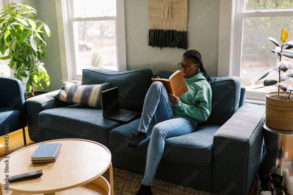 black teenage girl sitting down writing in a journal Stock Photo ...