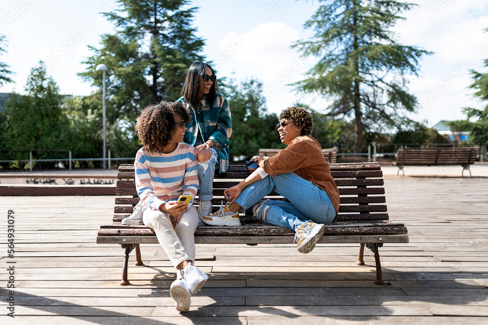 Happy cool Friends Talking Stock Photo | Adobe Stock