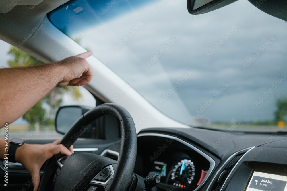 Driver pointing at storm Stock Photo | Adobe Stock