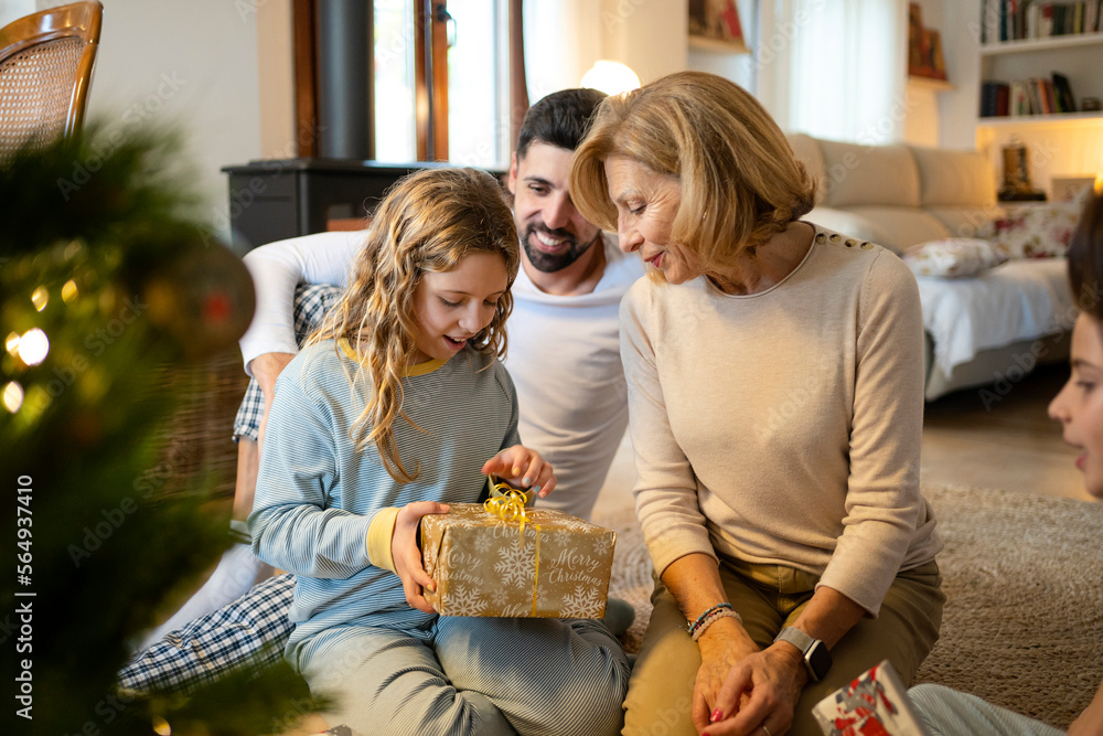 Happy Family Opening Christmas Gift Stock Photo | Adobe Stock